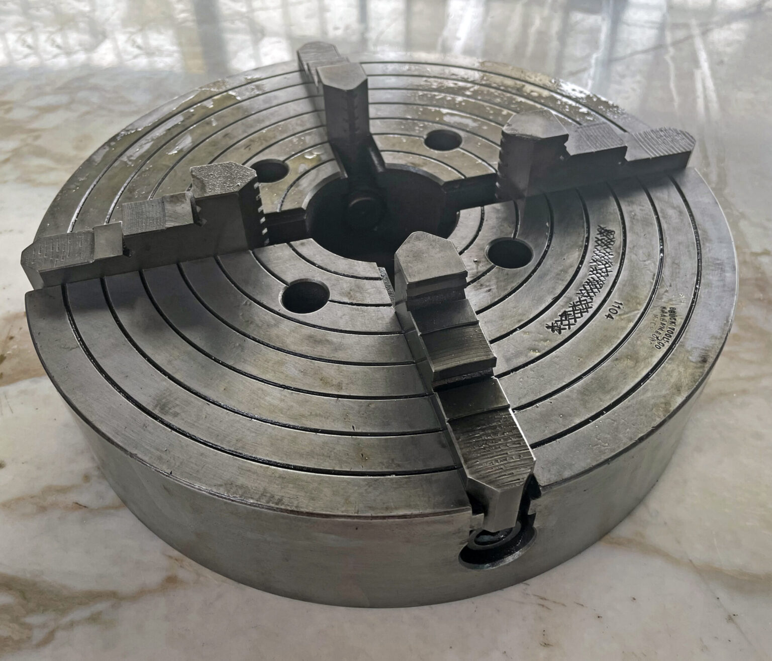 Buck Chuck 10" Solid 4-Jaw Chuck with Flat Back Mount - Norman Machine Tool